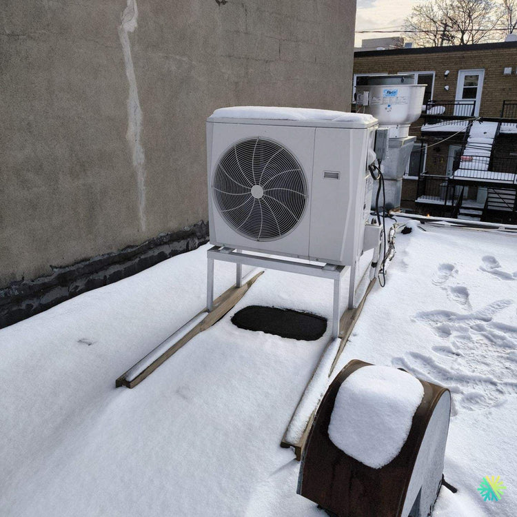 Installation d’une thermopompe centrale Gree sur toit plat au Plateau ...