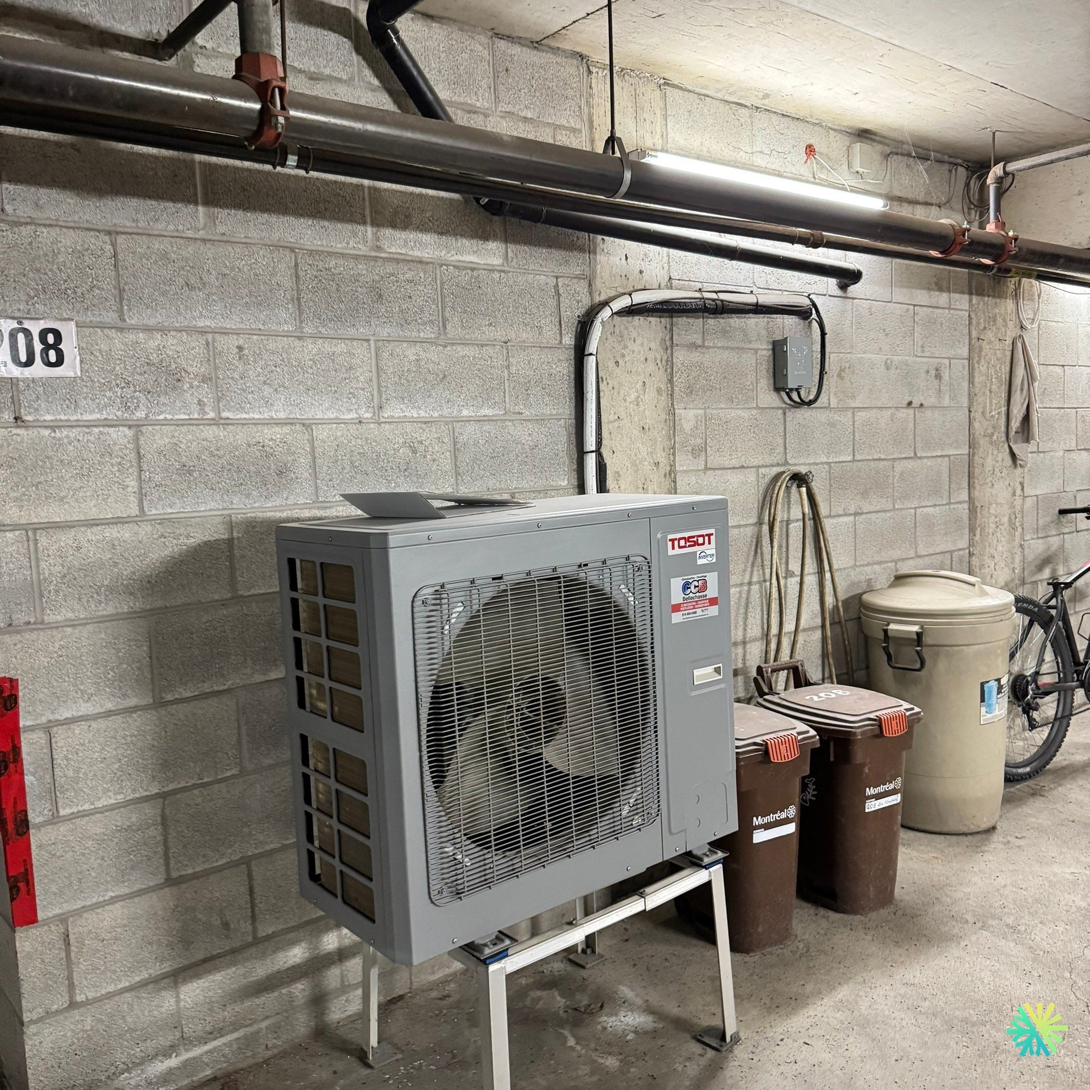 Installation of a Tosot central heat pump in an underground parking lo ...
