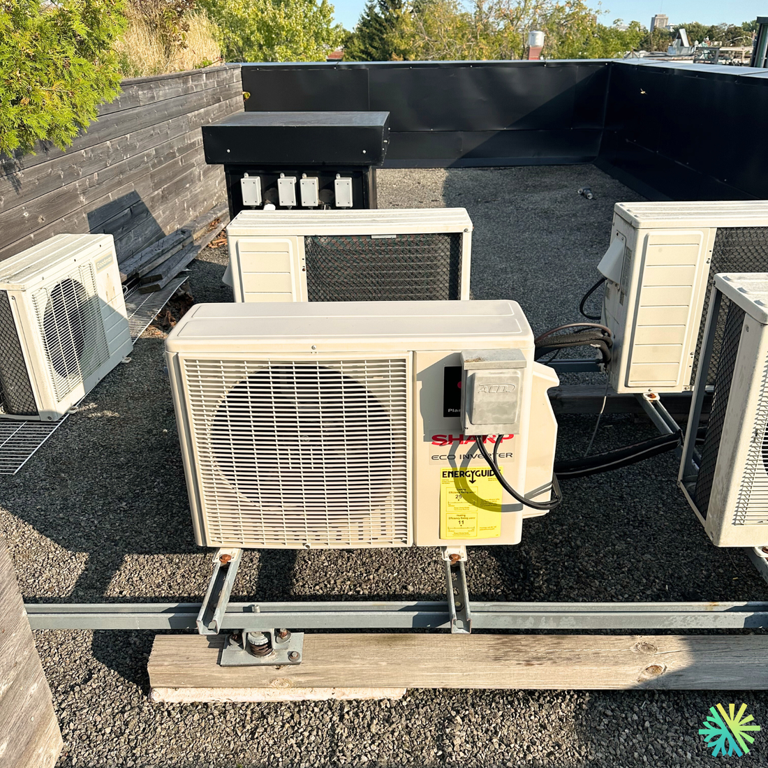 Repair of a Sharp wall-mounted heat pump on a rooftop terrace in Ville ...