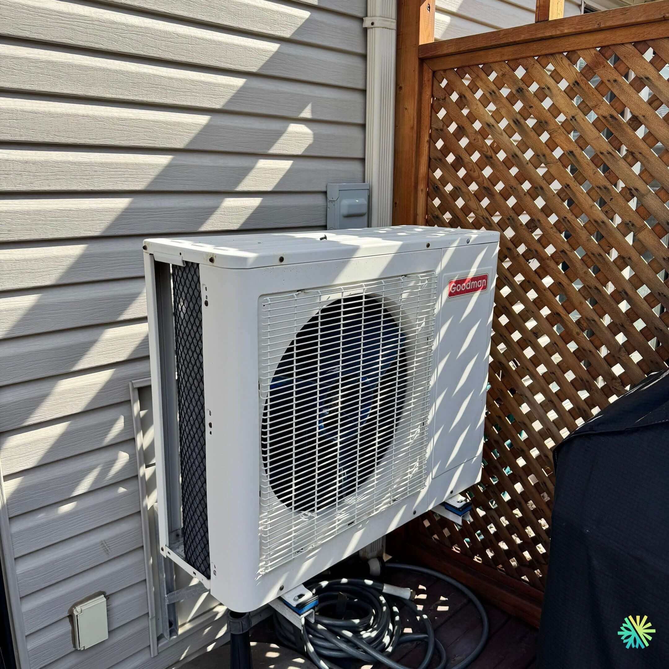 Installation of a Goodman wall-mounted heat pump (outdoor unit on terr ...